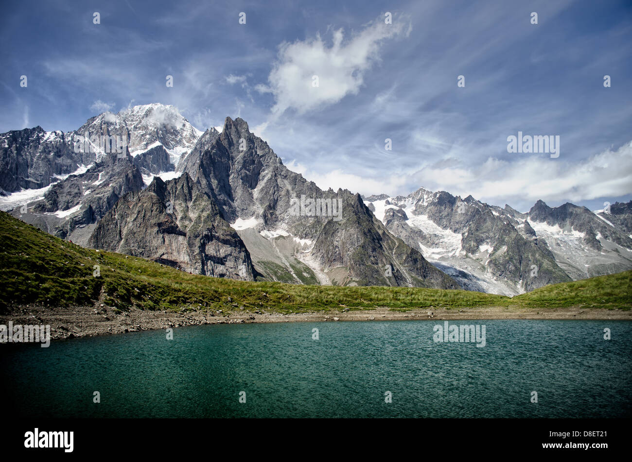 Small alpine lake and mountains in the Italian Alps Stock Photo - Alamy