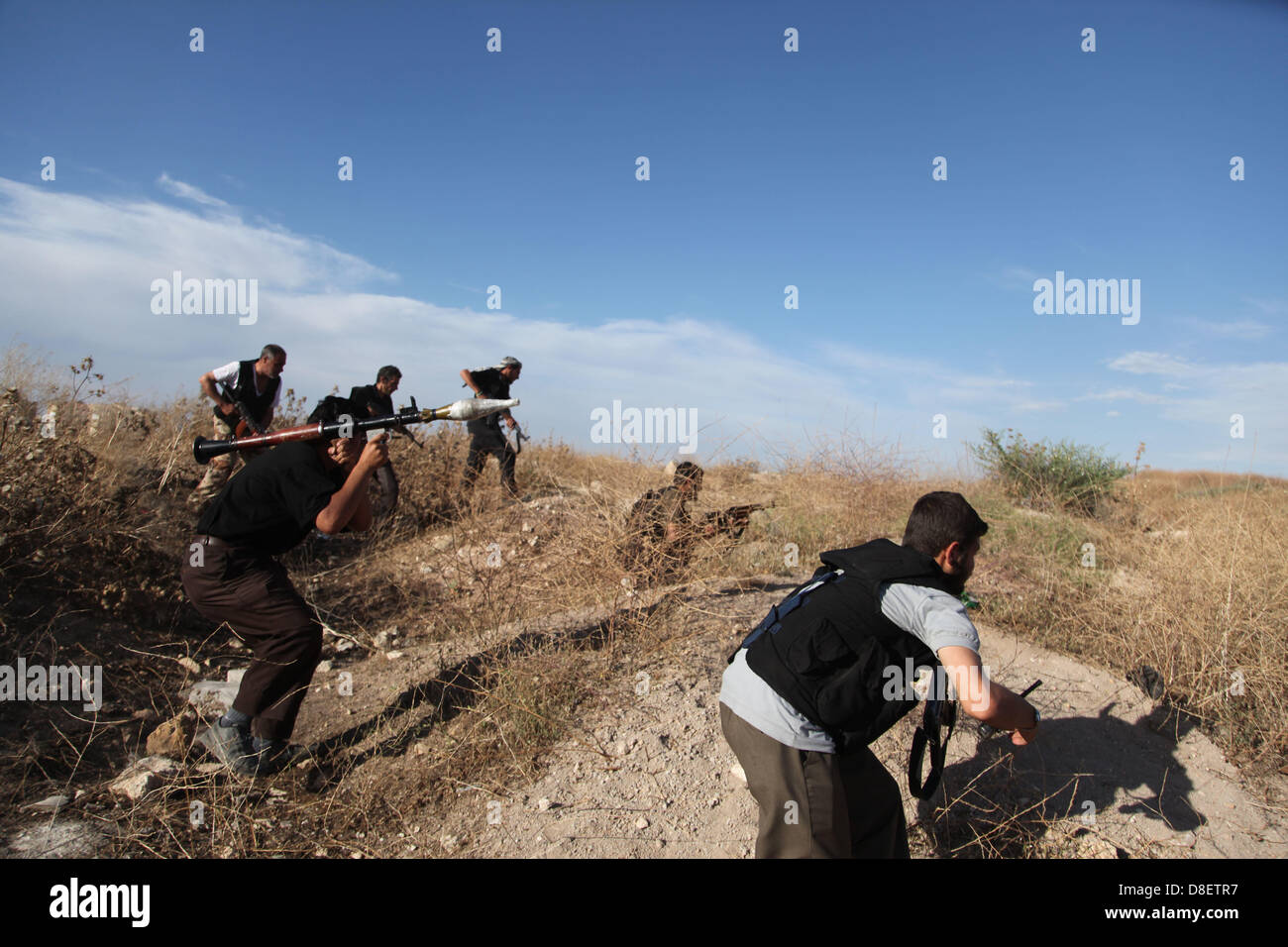 May 26, 2013 - Aleppo, Syria - Syrian rebels fire machine guns while ...
