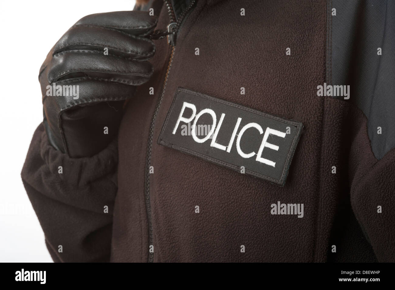 Police zip up jacket and police badge Stock Photo - Alamy