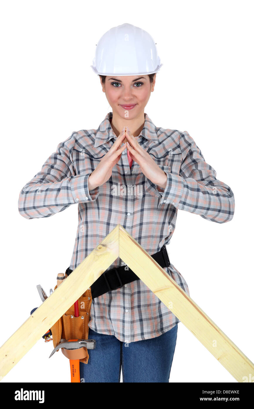 Female builder with a timber apex Stock Photo - Alamy
