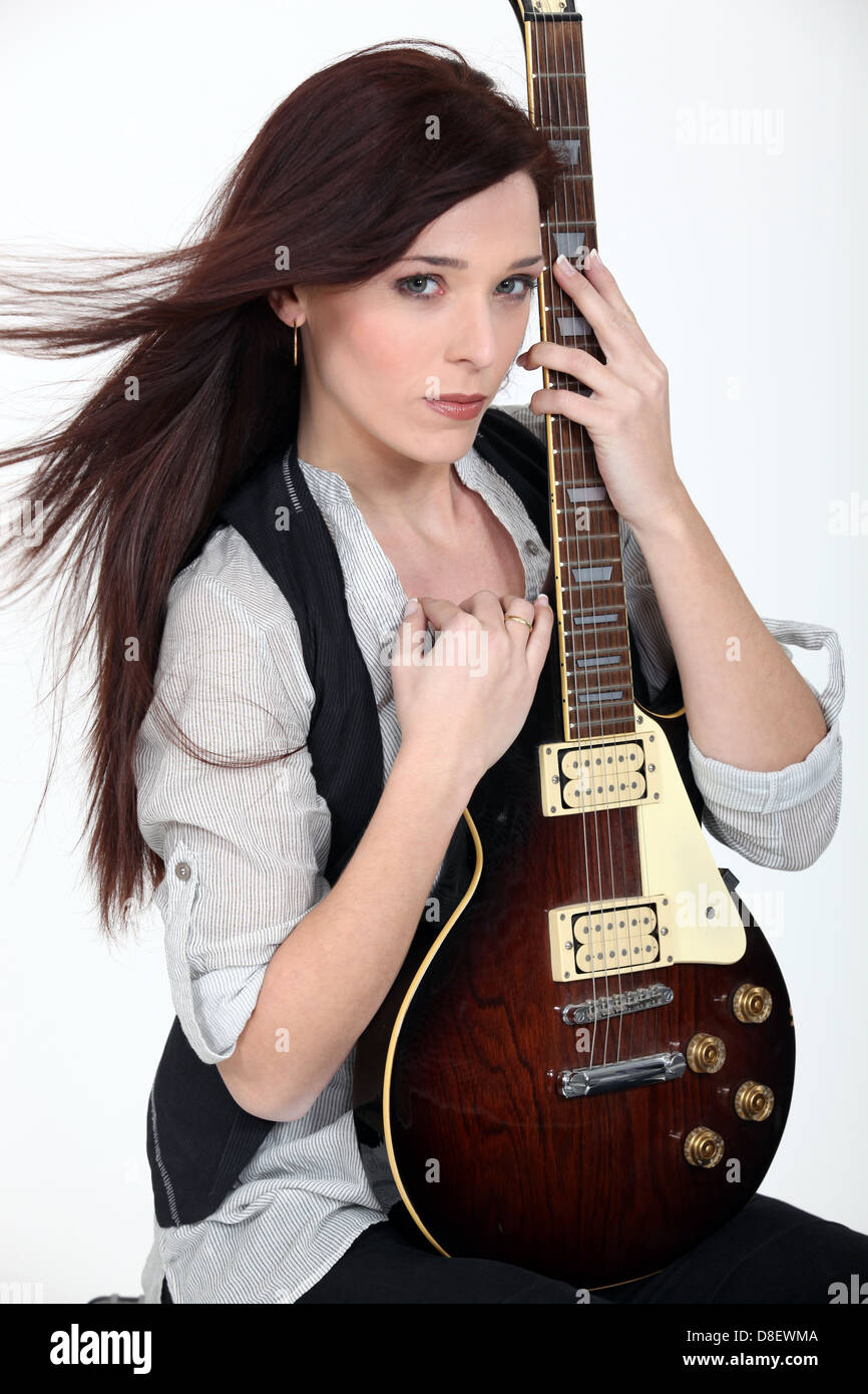 Woman with electric guitar Stock Photo - Alamy