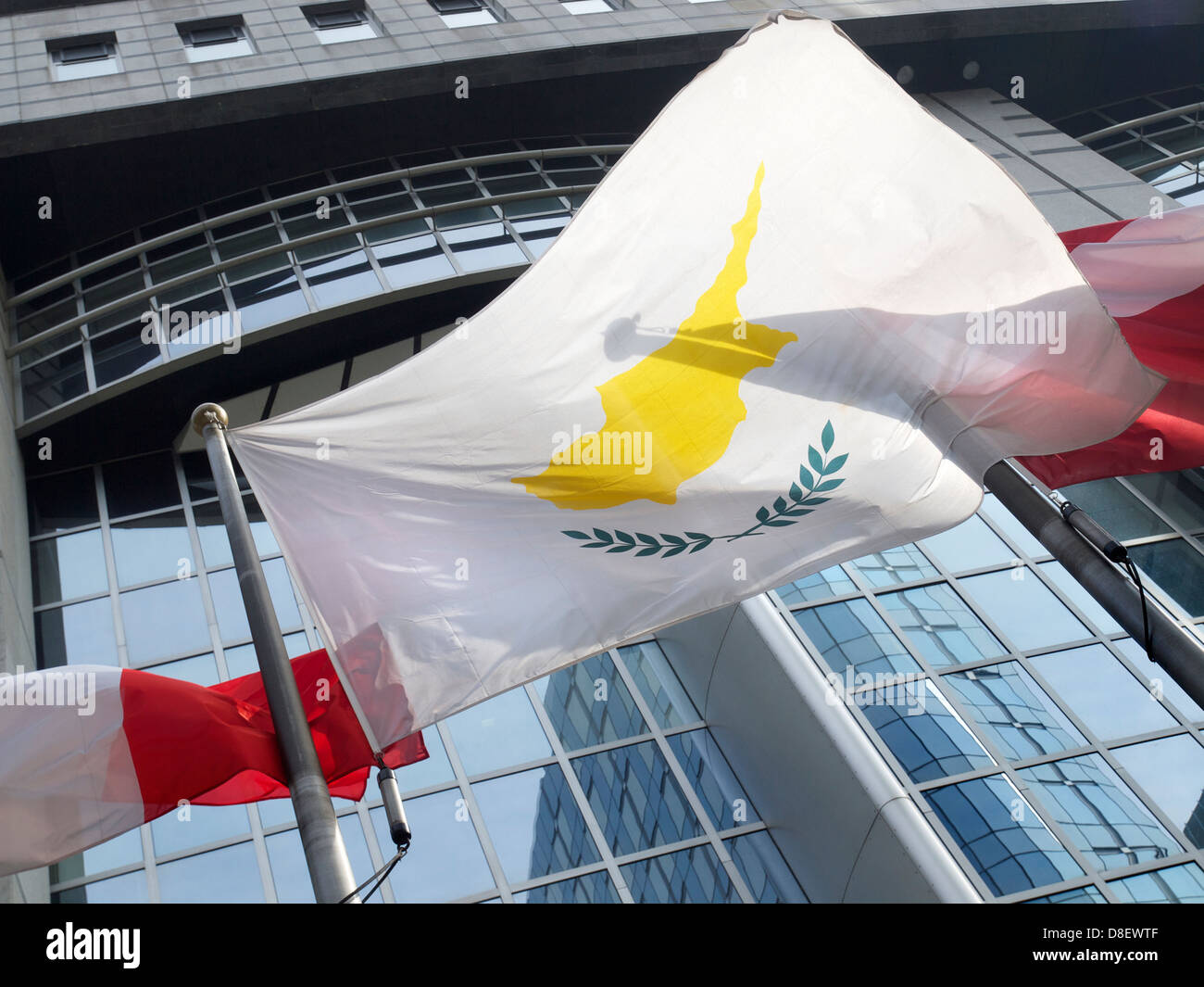 Flag of Cyprus waving in front of the EU parliament building in ...