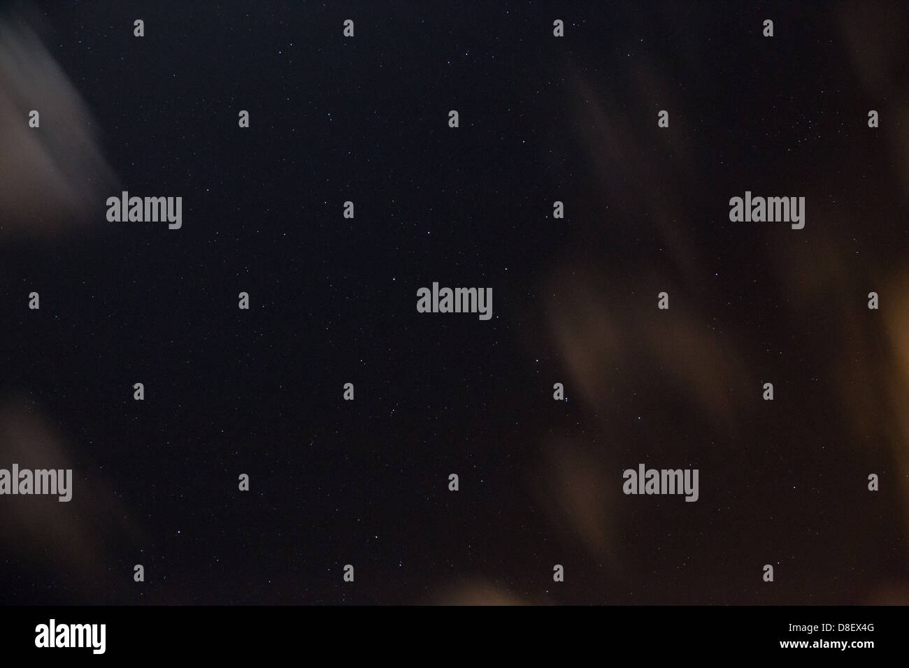 Long exposure shot of the nights sky. Stars shining through with some ...