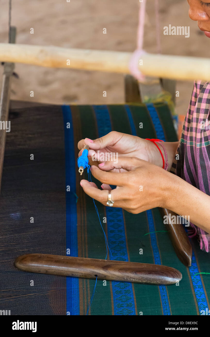 Close-Up of a Woman's Hands weaving Silk on Silk Island (Koh Dach) in ...