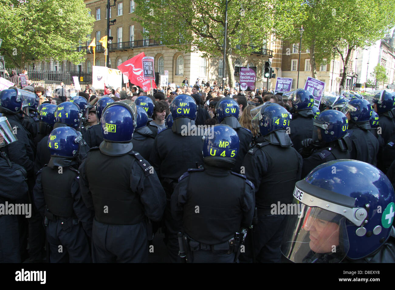 Police officers contains demonstrators at Whitehall. Credit David Mbiyu ...