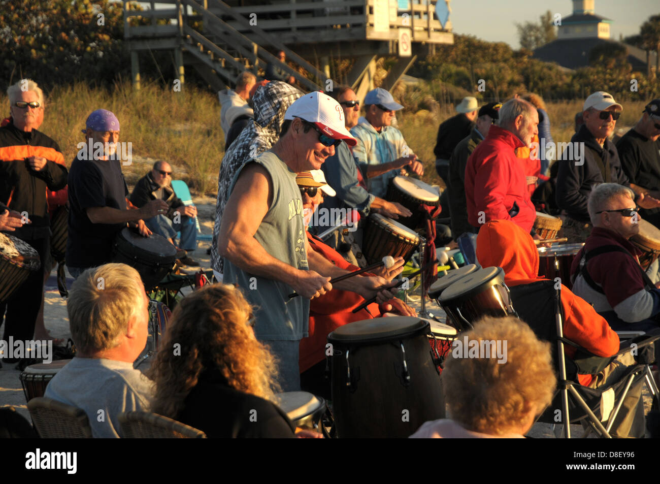 A group gathers on Nokomis, Florida beach to play drums as the sun sets ...