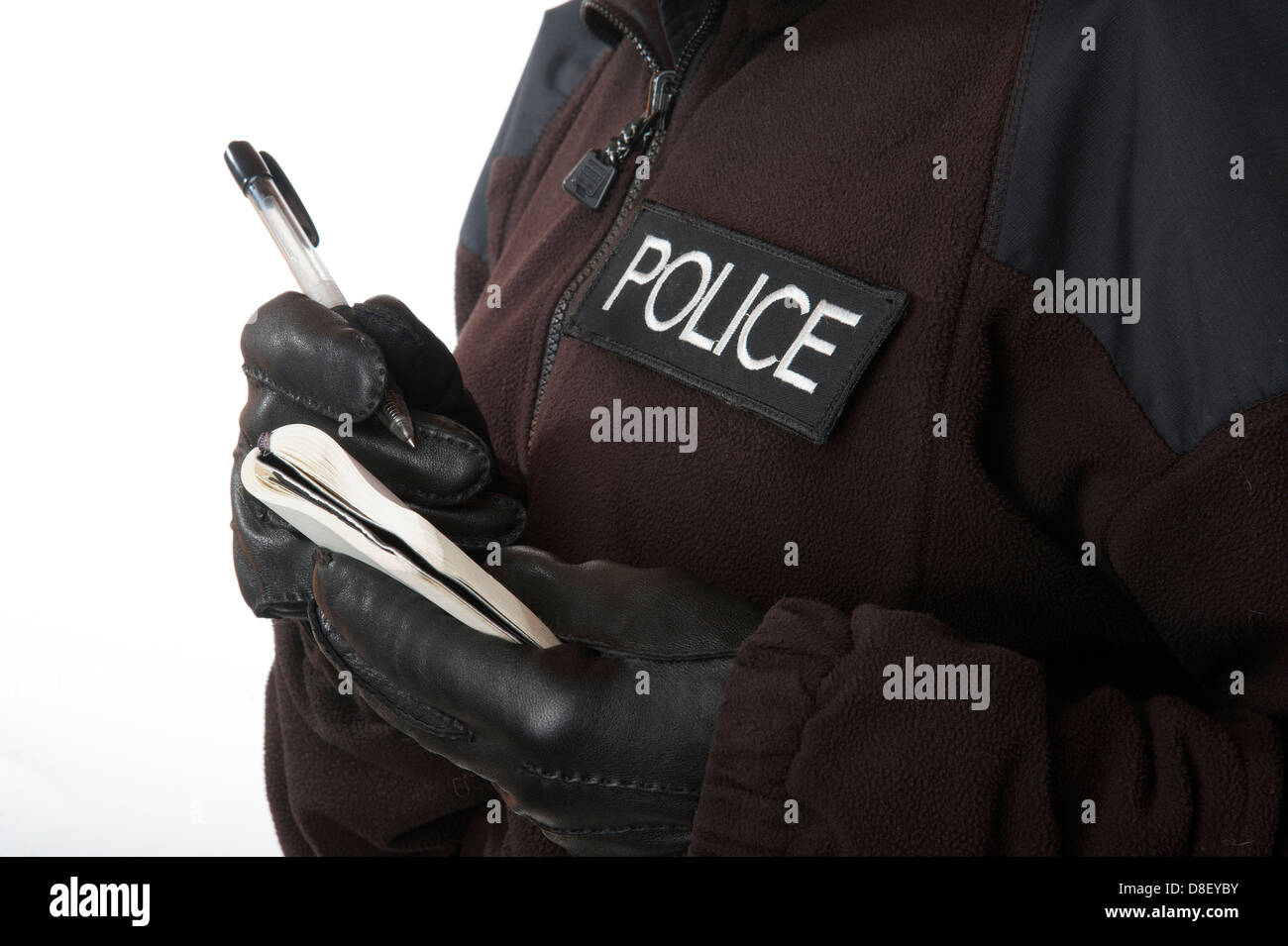 Police notebook and pen being used by a woman officer to take a ...