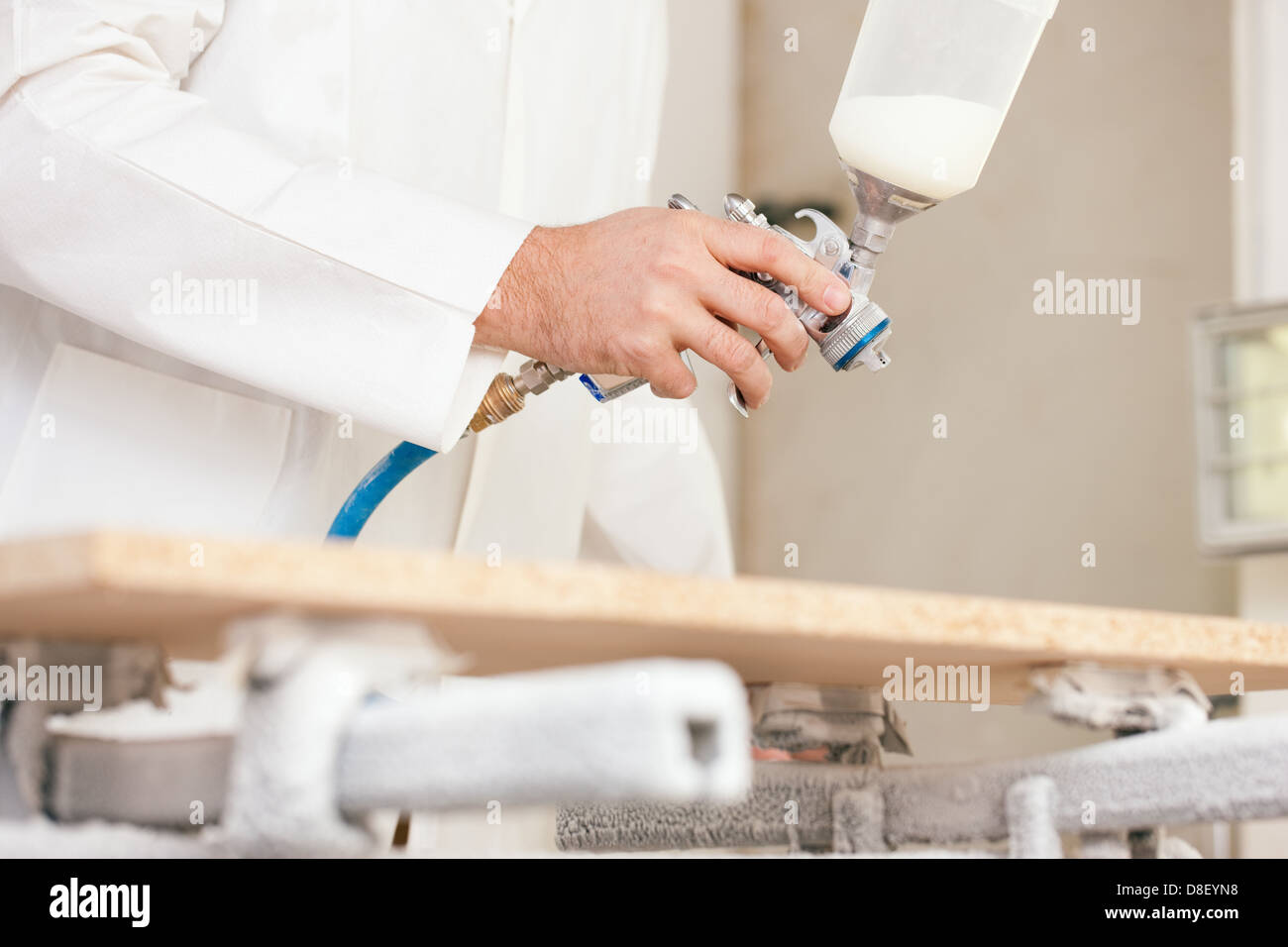 Painter using spray paint and an airbrush for his work Stock Photo - Alamy