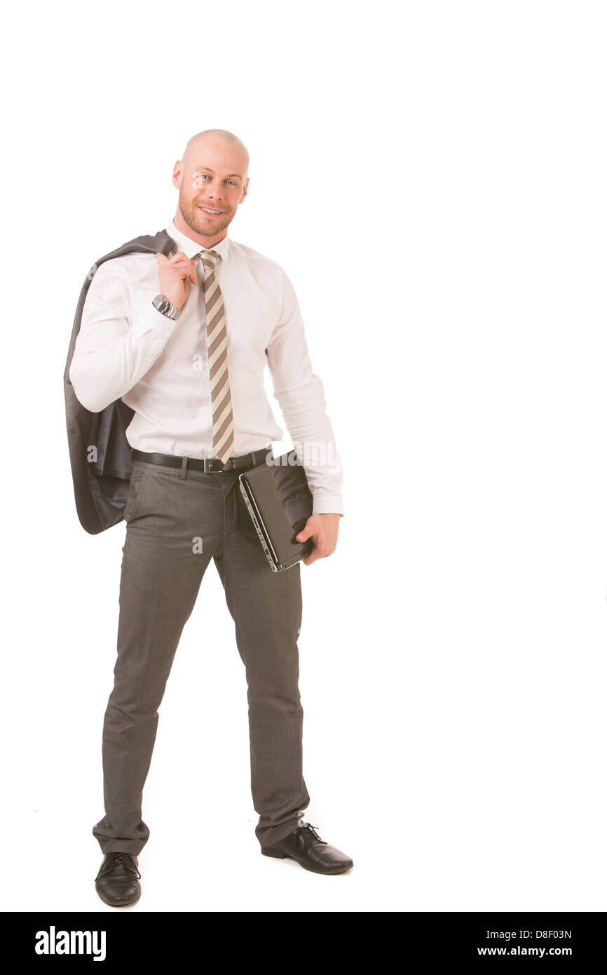 Relaxed businessman with suit jacket thrown over the shoulder and ...