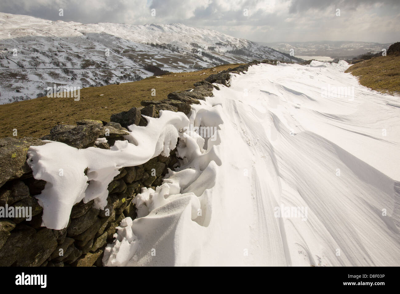 Massive snow drifts block the Kirkstone Pass road above Ambleside in ...