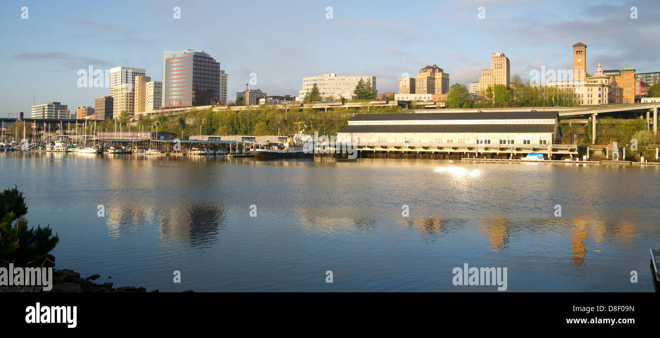 The sun rises hitting the waterfront and buildings of Downtown Tacoma ...