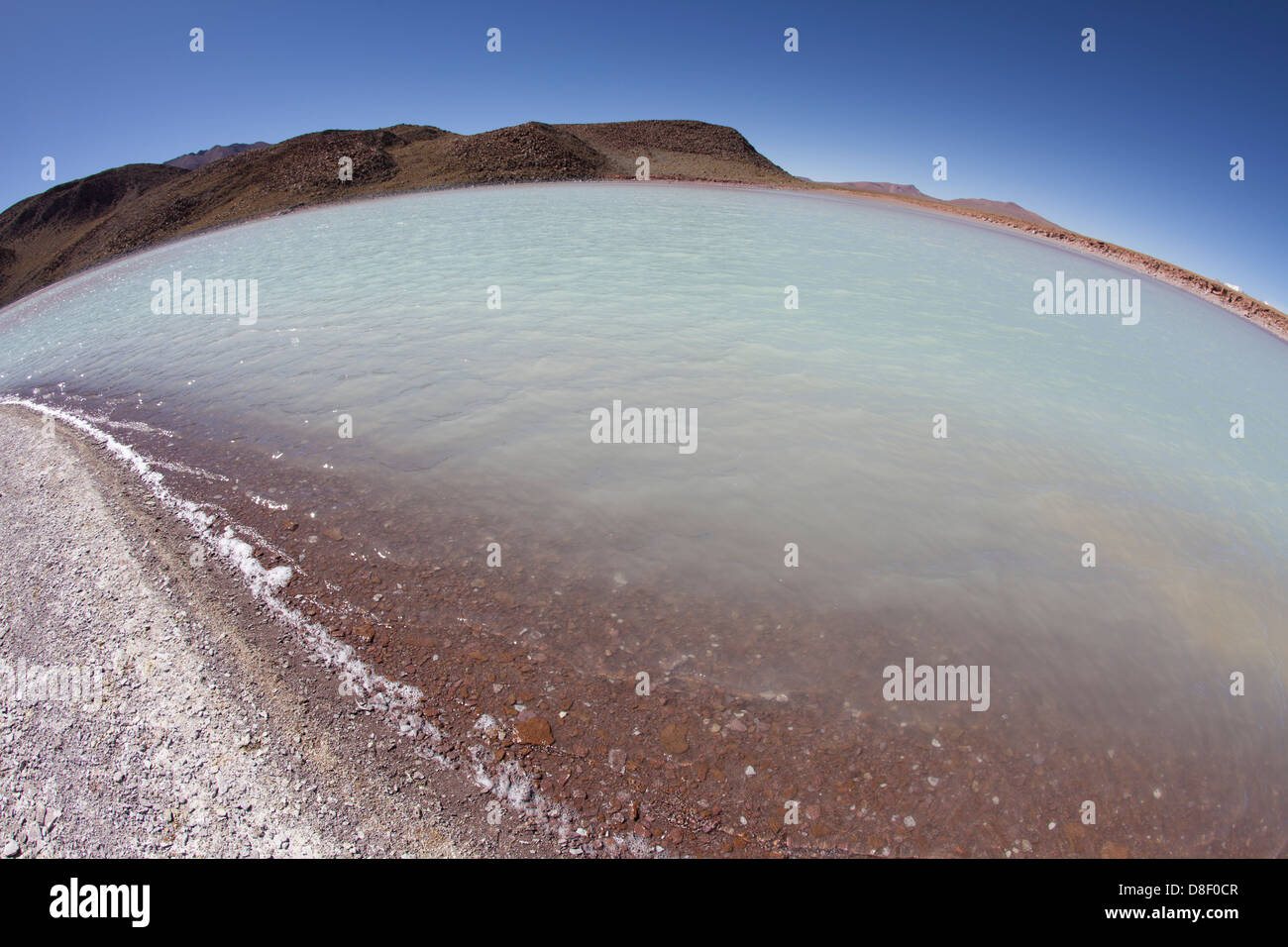 The blue Lagoon on the foothills of the Uturuku Volcano in the Bolivian ...
