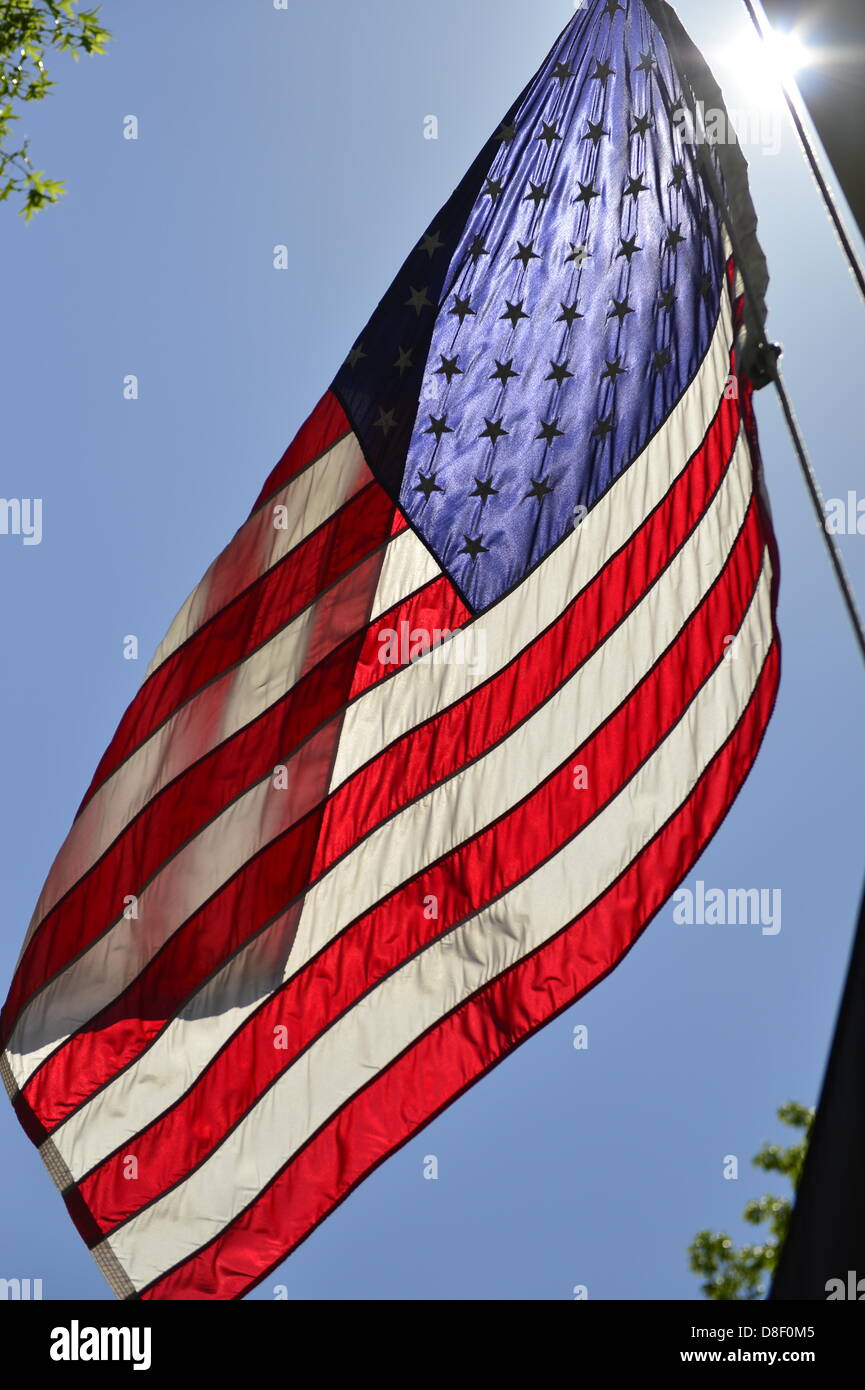Merrick, New York, USA. 27th May 2013. American Flag is lowered to fly ...