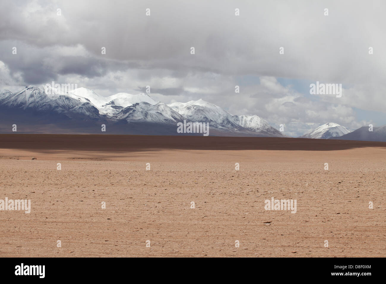 The dry arid landscape of the Bolivian Altiplano where it slopes down ...