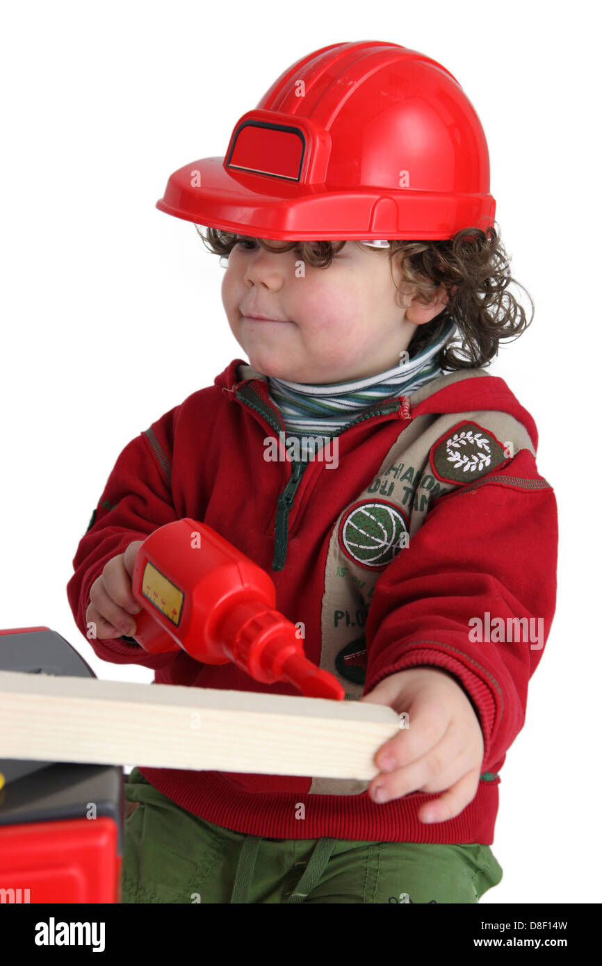 Little boy with toy drill pretending to be workman Stock Photo - Alamy