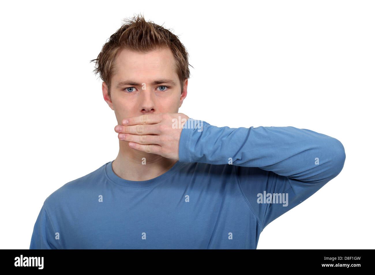 Man with hand on mouth Stock Photo - Alamy