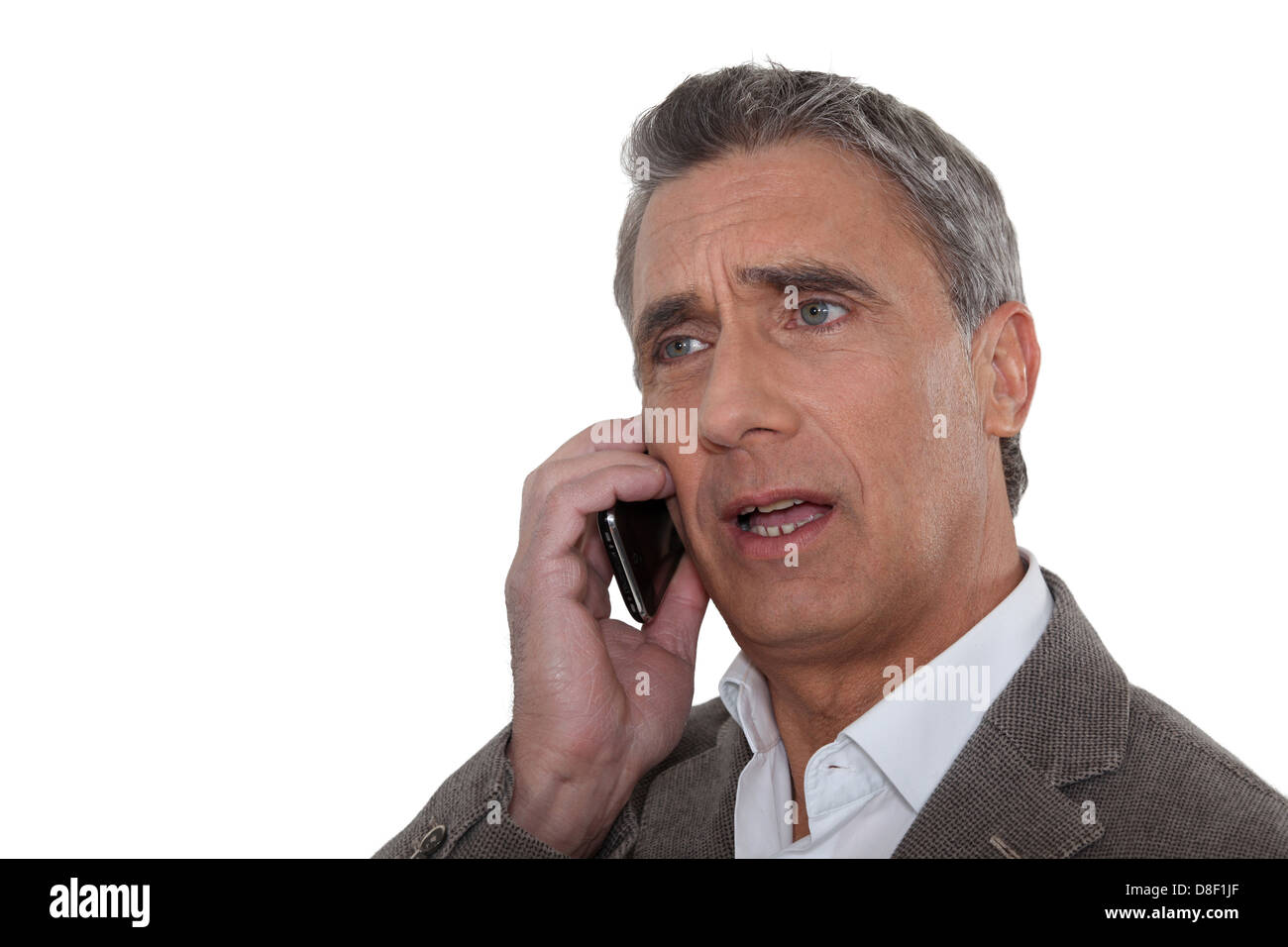 Man yelling into his mobile phone Stock Photo - Alamy