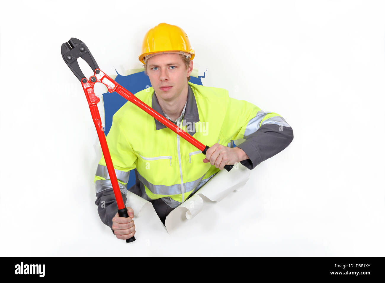 Man with bolt-cutters tearing through background Stock Photo - Alamy