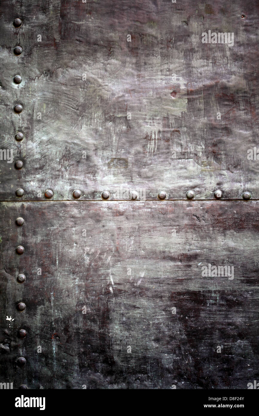 Black grunge metal plate or armour texture with rivets as background ...