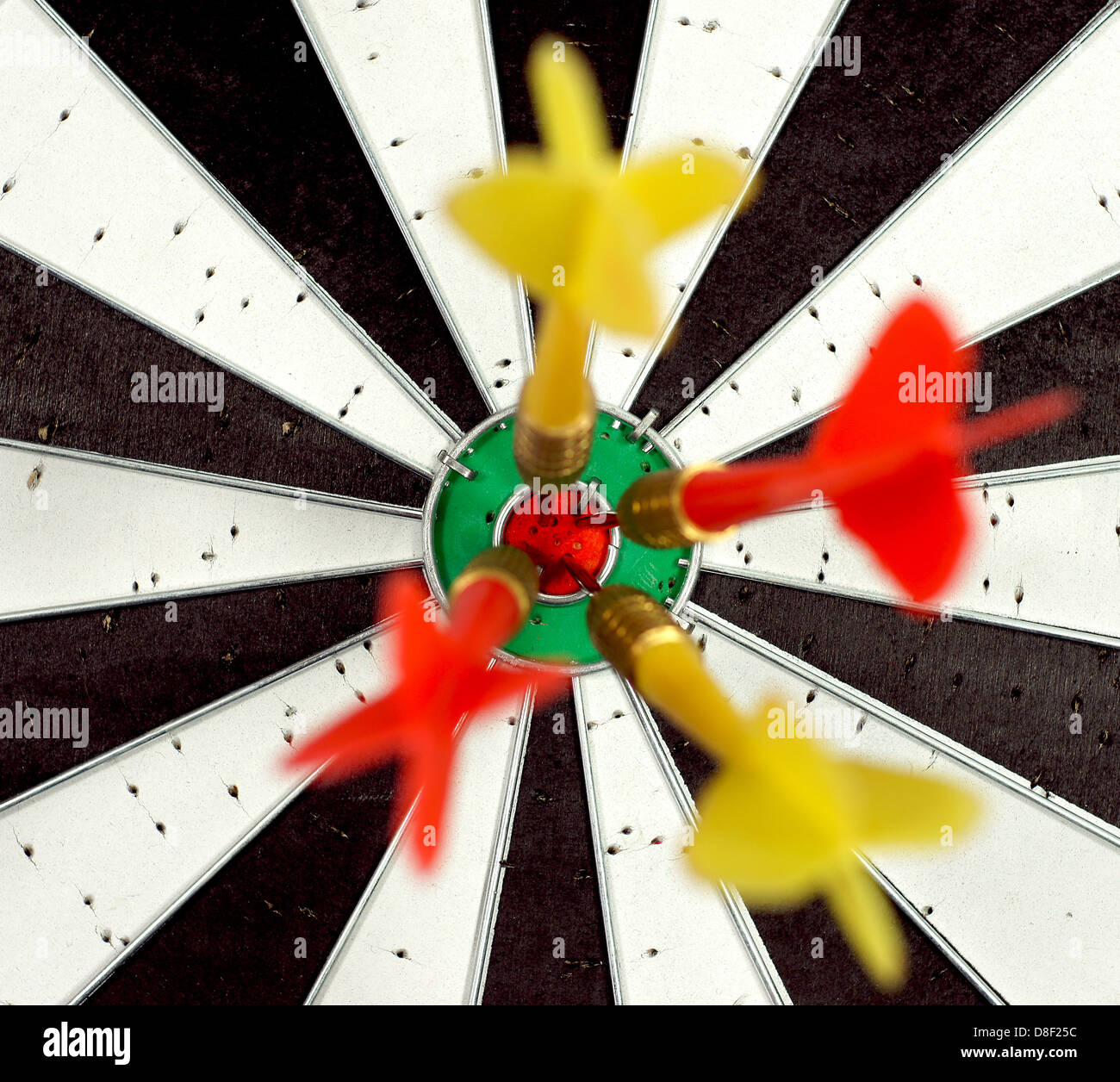 Dartboard with 4 darts Stock Photo - Alamy