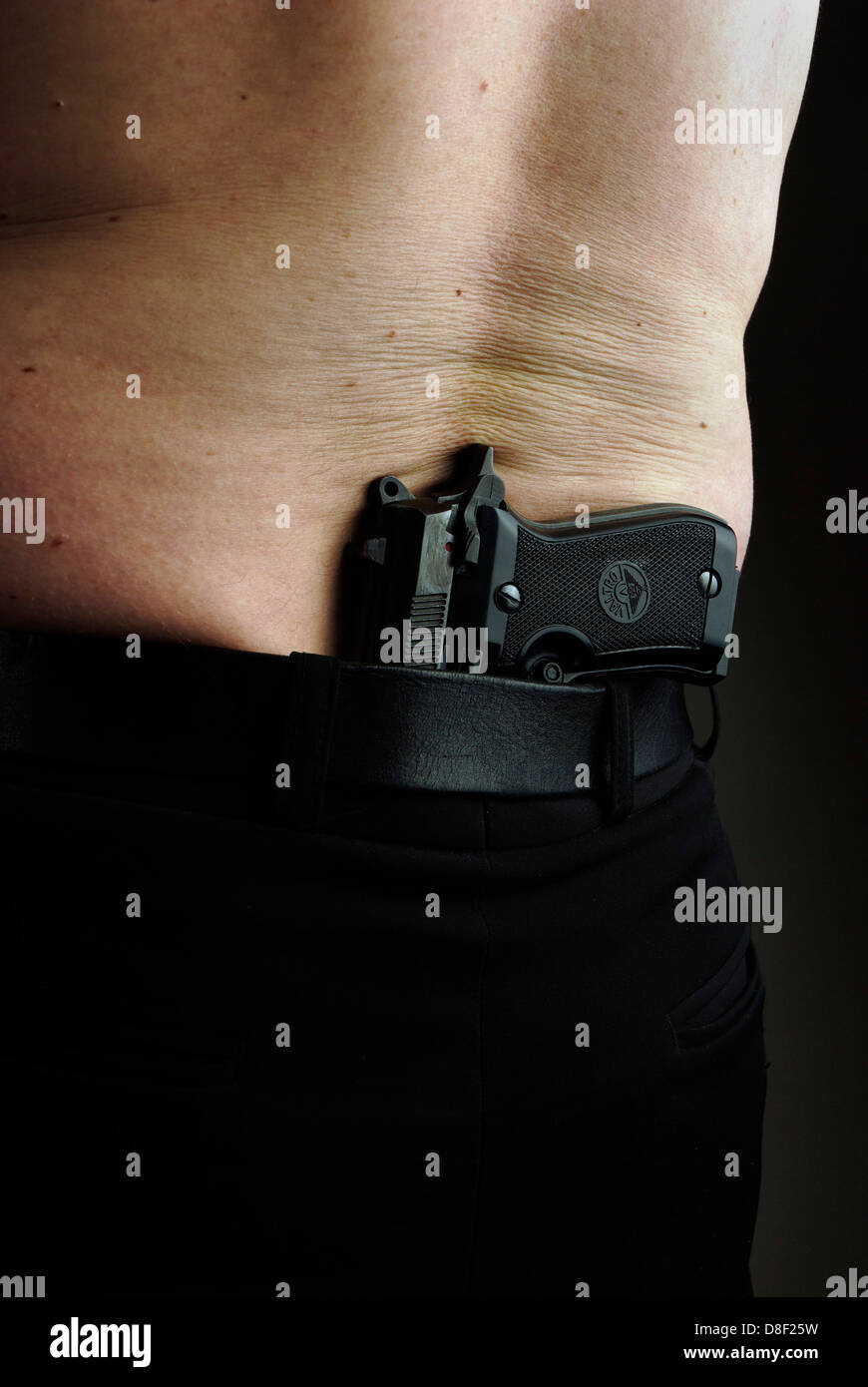The back of a man with a gun Stock Photo - Alamy