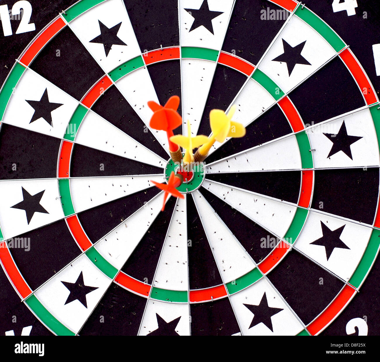 Dartboard with 4 darts Stock Photo - Alamy