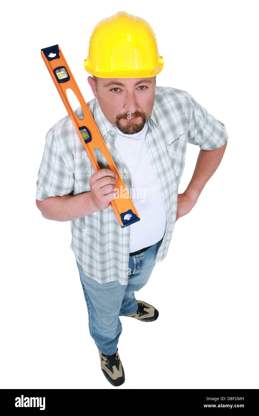 Man holding spirit level Stock Photo - Alamy