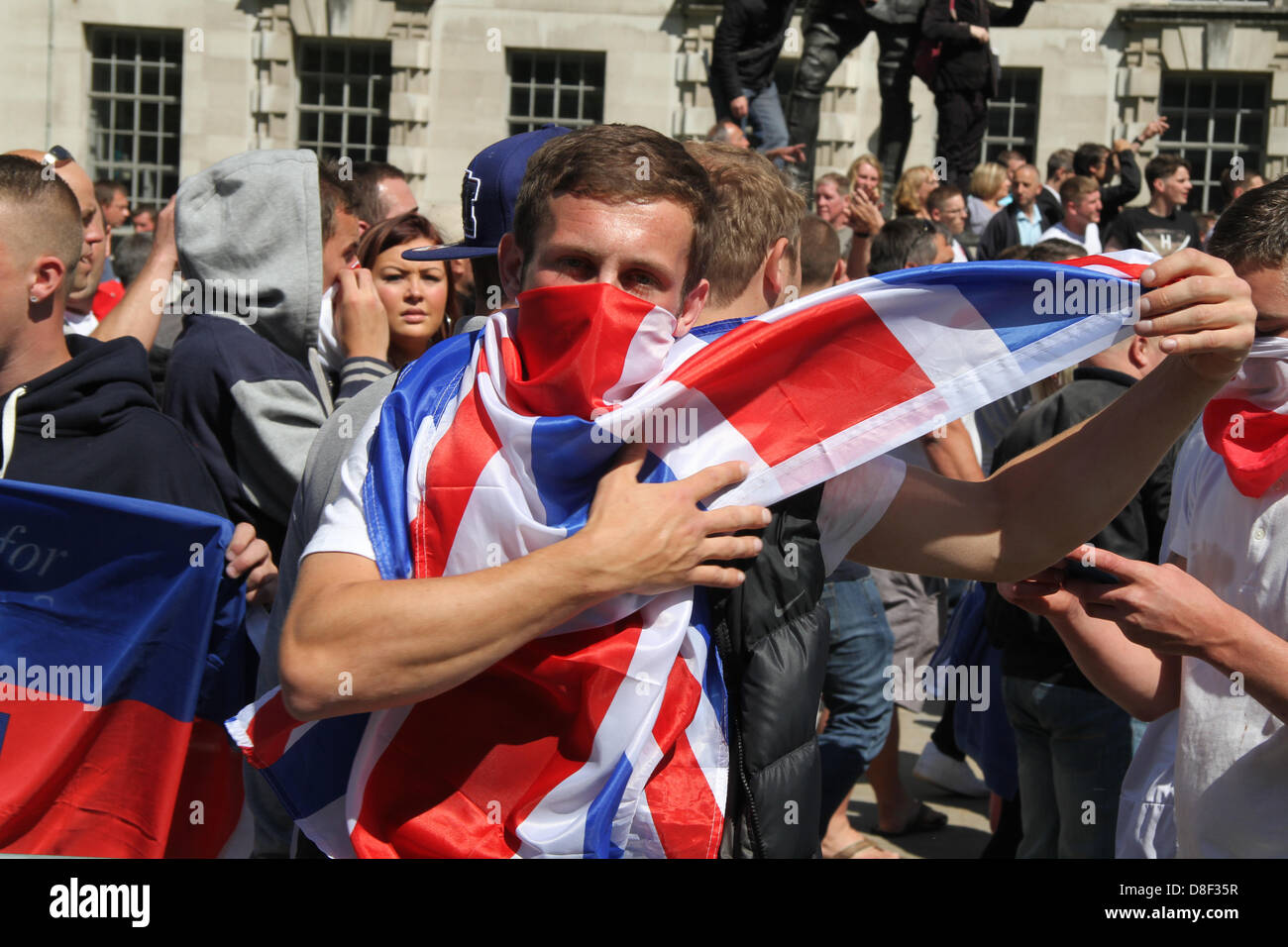 A EDL ( English Defense League) member seen with a flag. Credit David ...
