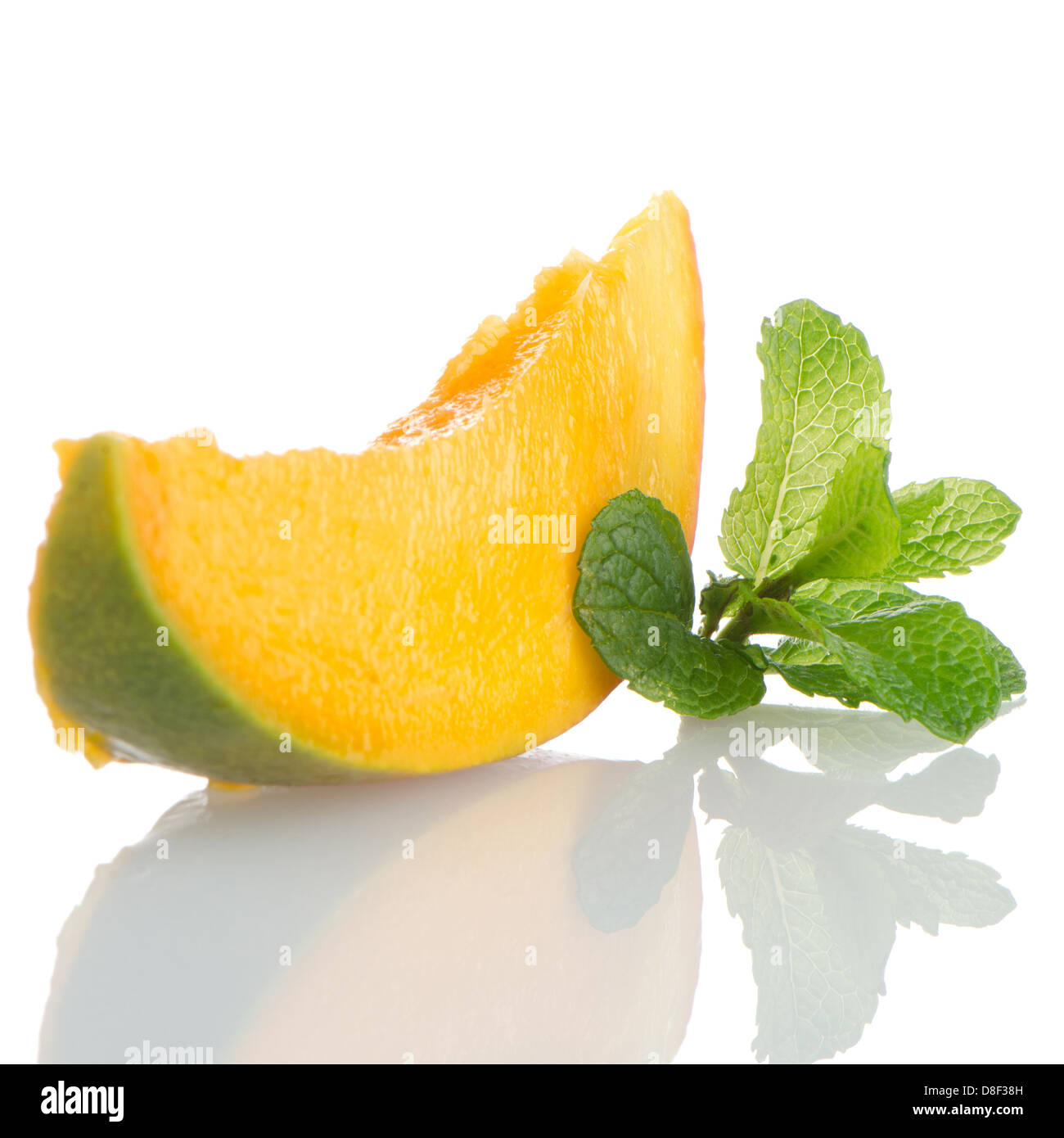 Mango fruit slice on white reflective background Stock Photo - Alamy