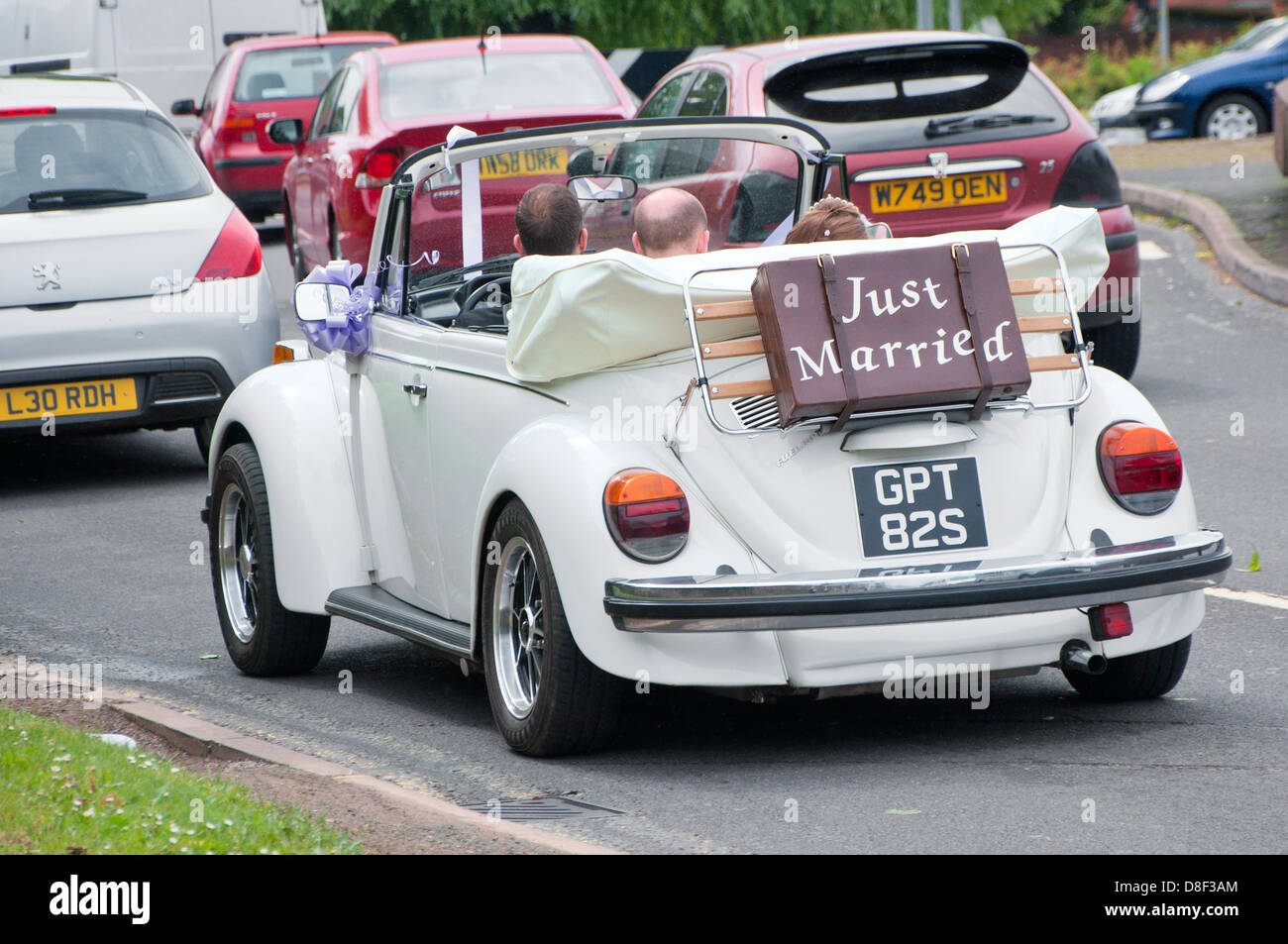 Married couple in Volkswagen car Stock Photo - Alamy