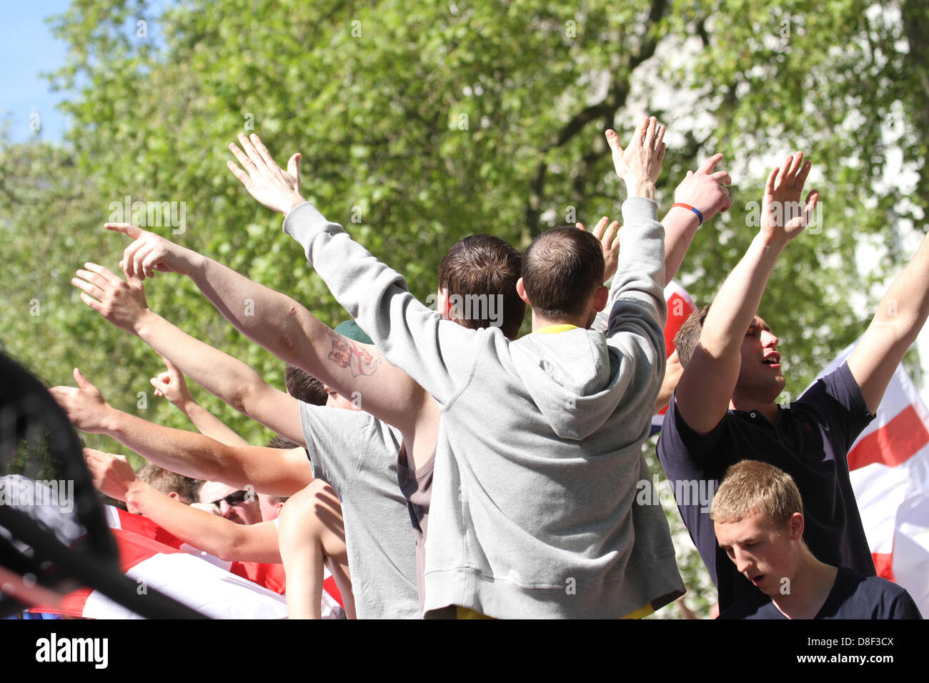 The EDL ( English Defense League) members cheer at one of the speakers ...