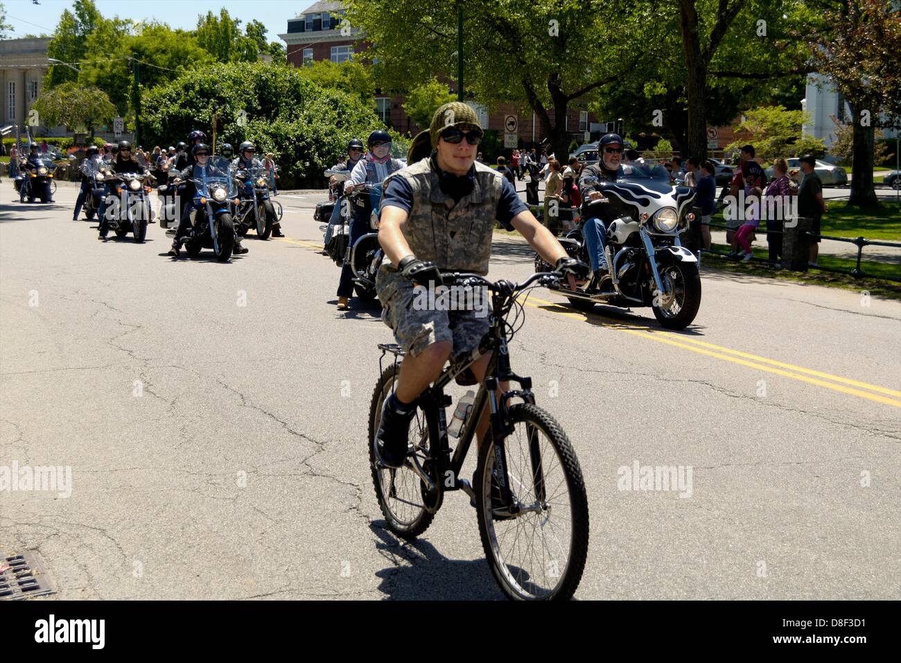 Wakefield, Massachusetts USA - May 27 2013 - Young man rides bike ...