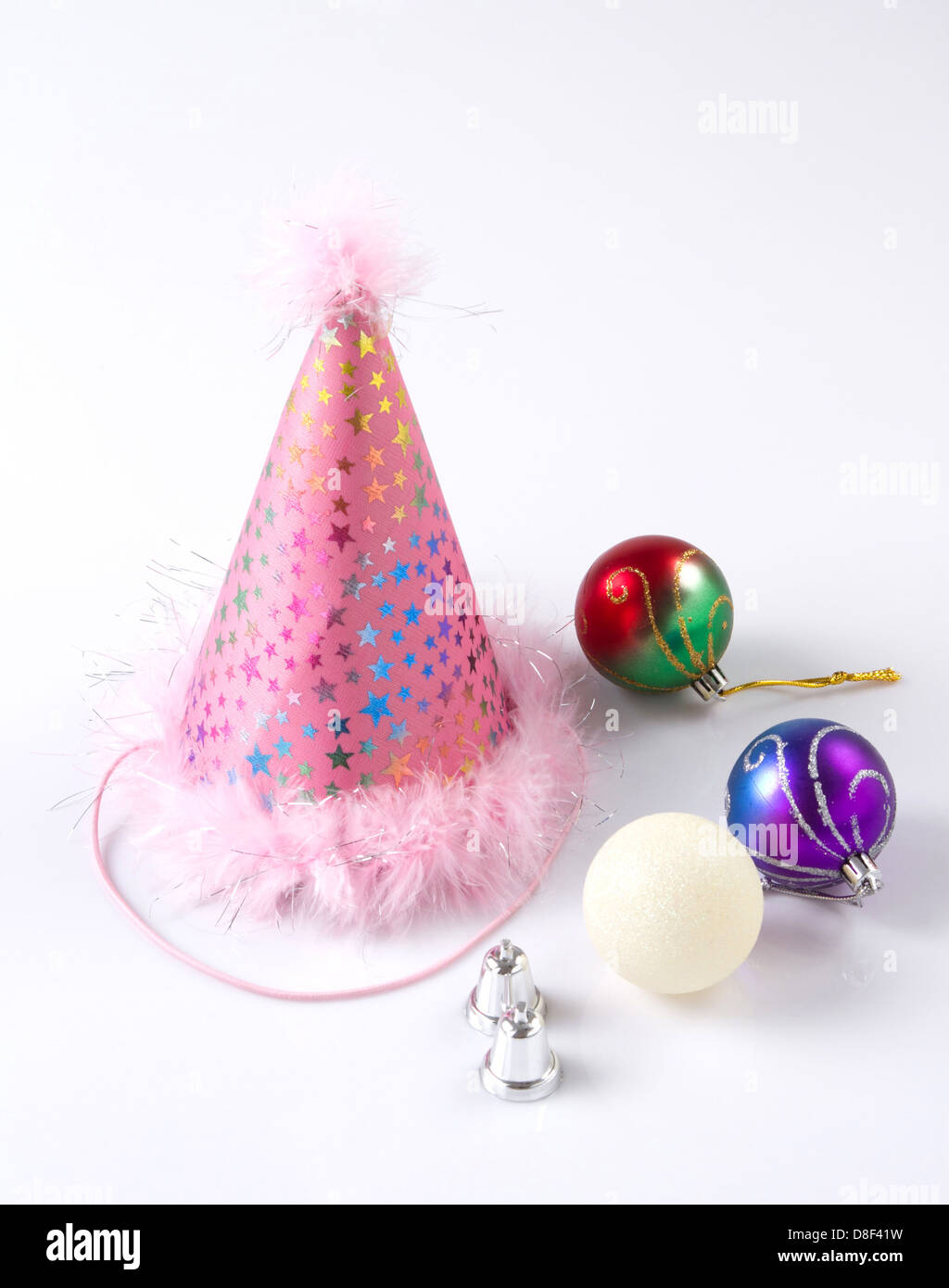 A cute party hat with colorful baubles and small bells Stock Photo - Alamy