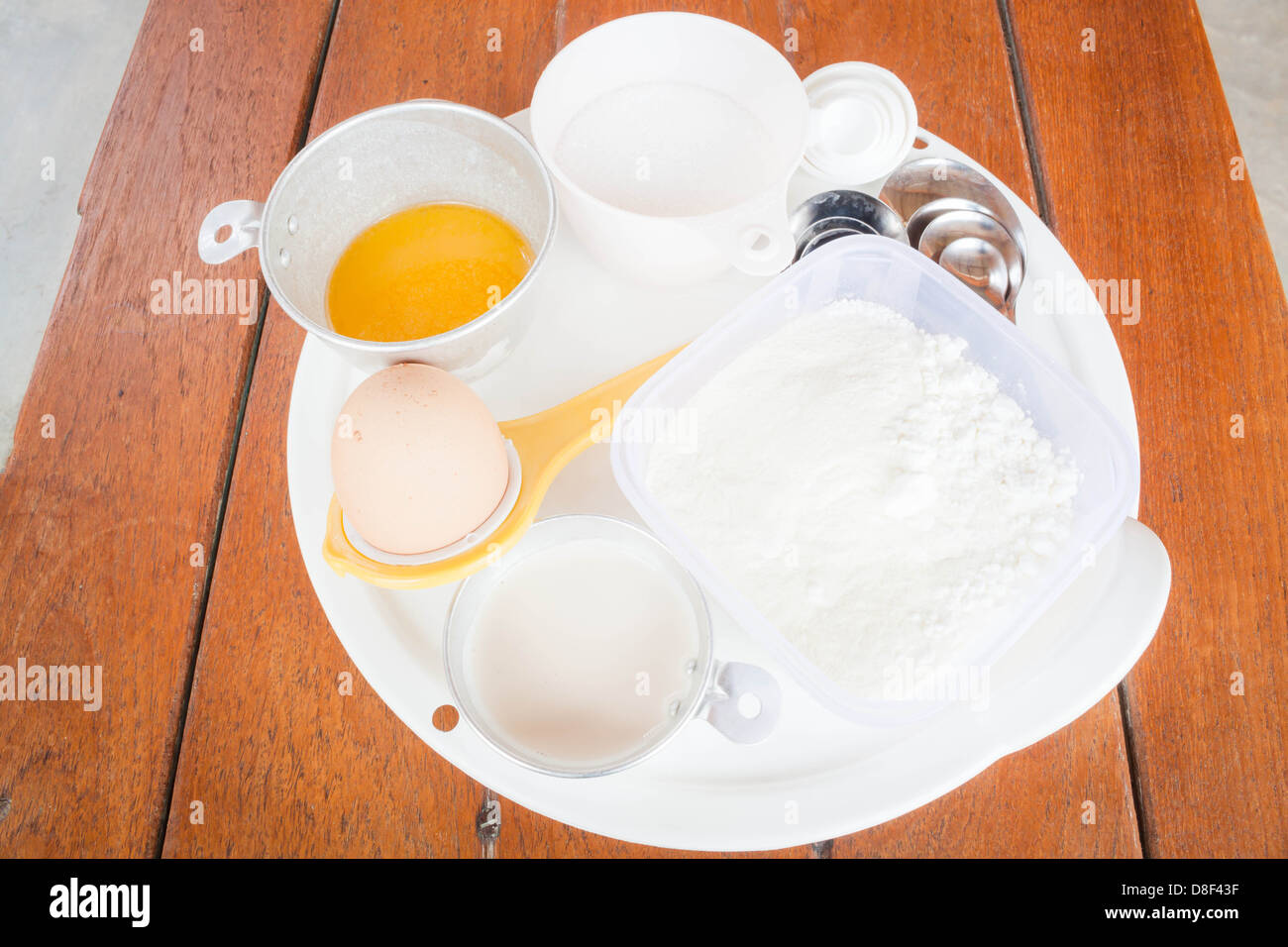 Set of baking ingredients with measure spoon Stock Photo - Alamy