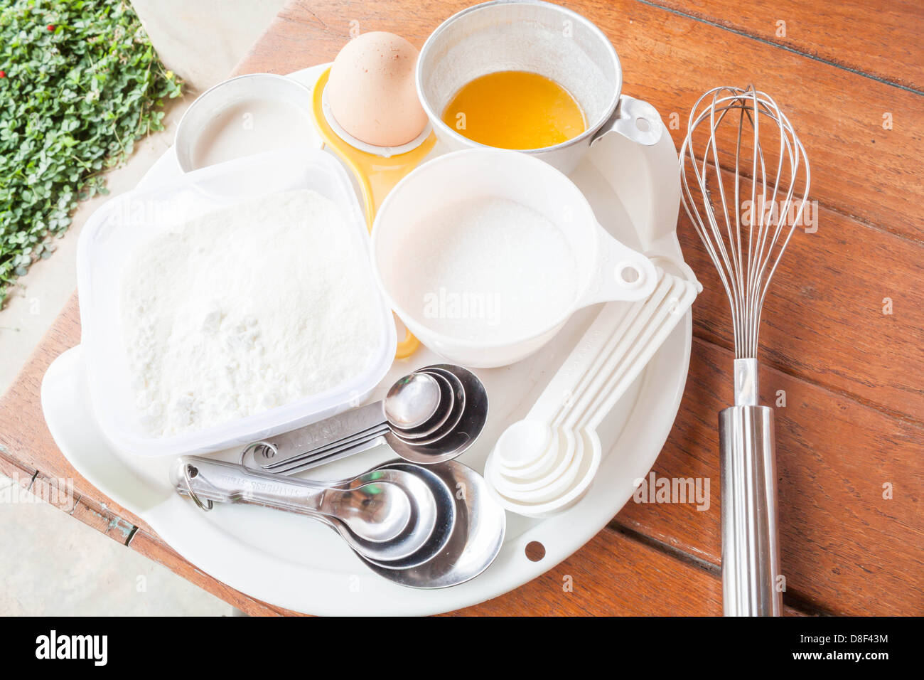 Set of baking ingredients with measure spoon Stock Photo - Alamy