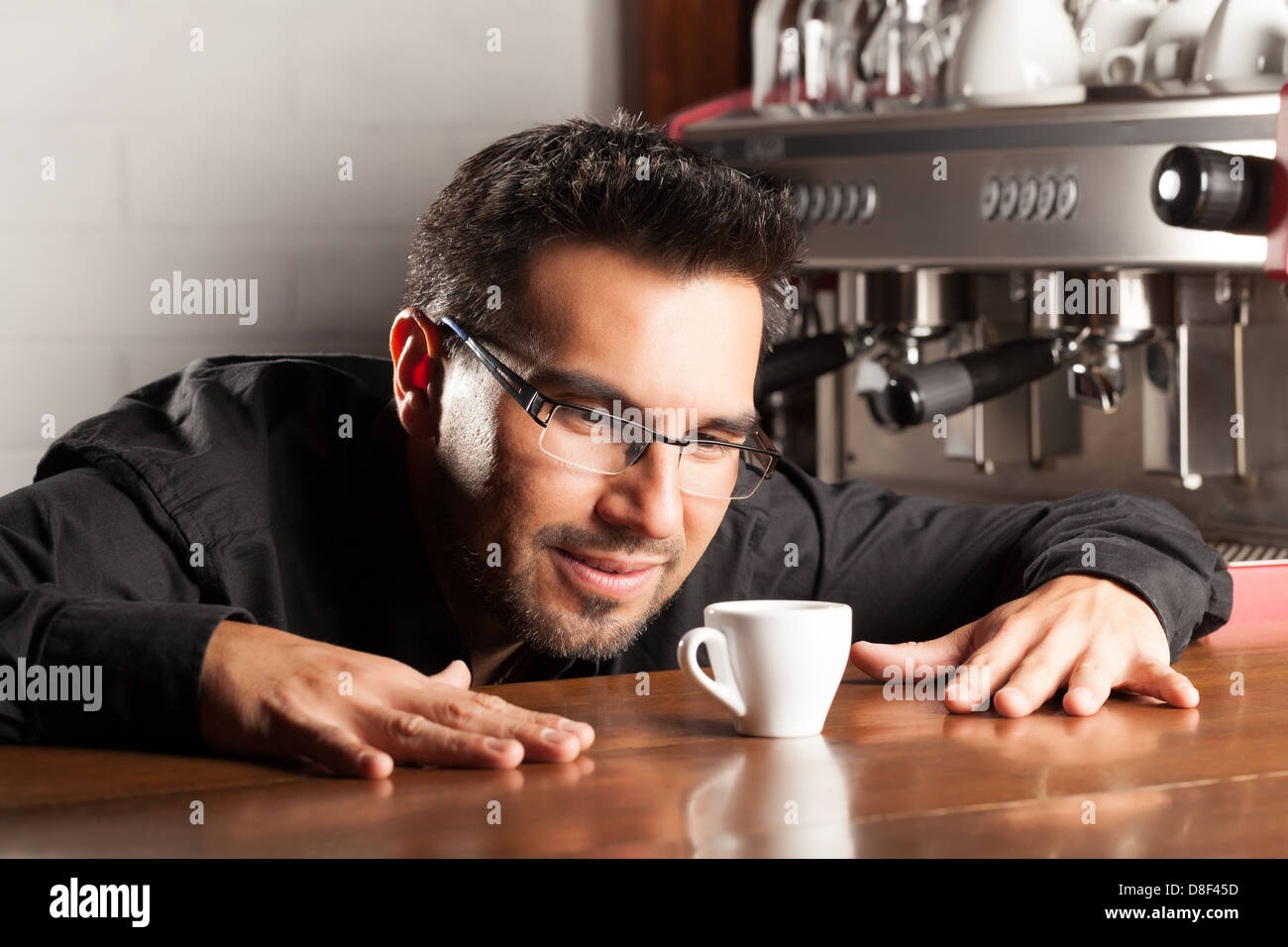 Sommelier Examining Coffee Cream In Espresso Cup Stock Photo - Alamy