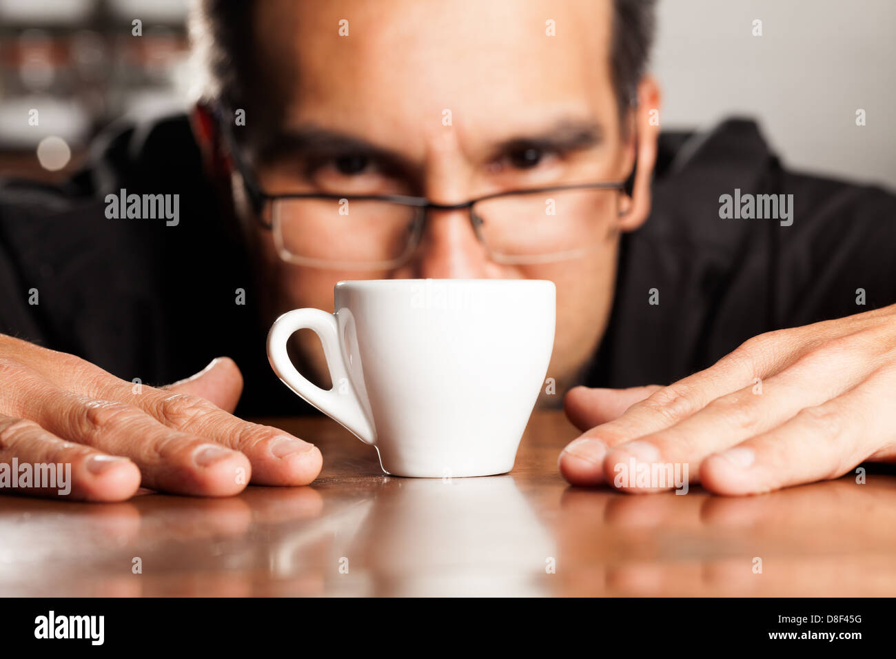 Sommelier Examining Coffee Cream In Espresso Cup Stock Photo - Alamy