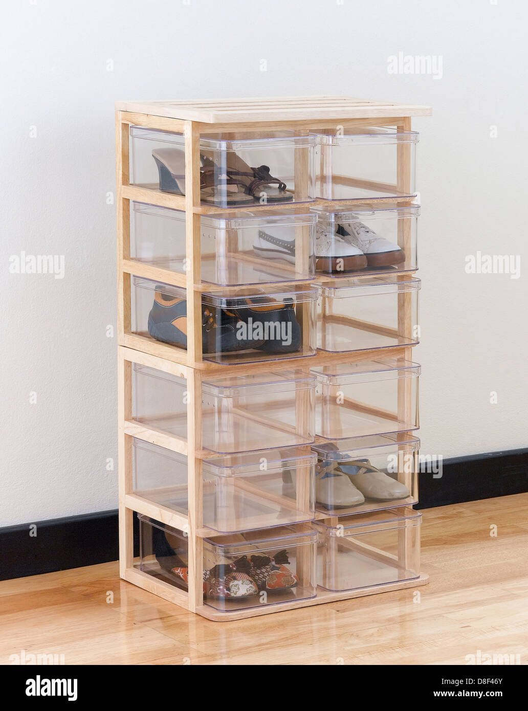 A modern design of shoe boxes on a wooden stand for storage the shoes ...