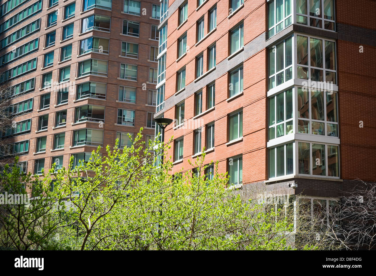 Modern apartments with natural landscaping of trees Stock Photo - Alamy