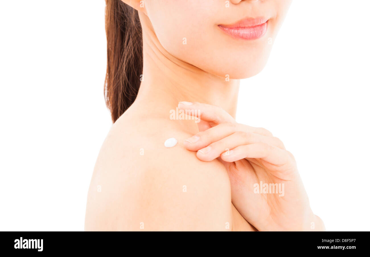shoulder of young woman applying moisturize cream Stock Photo - Alamy