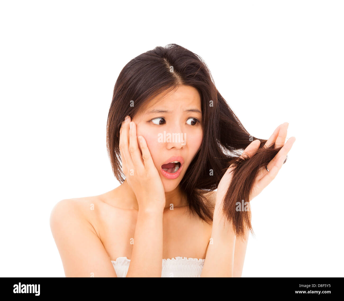 shocked woman watching the damage hair Stock Photo - Alamy