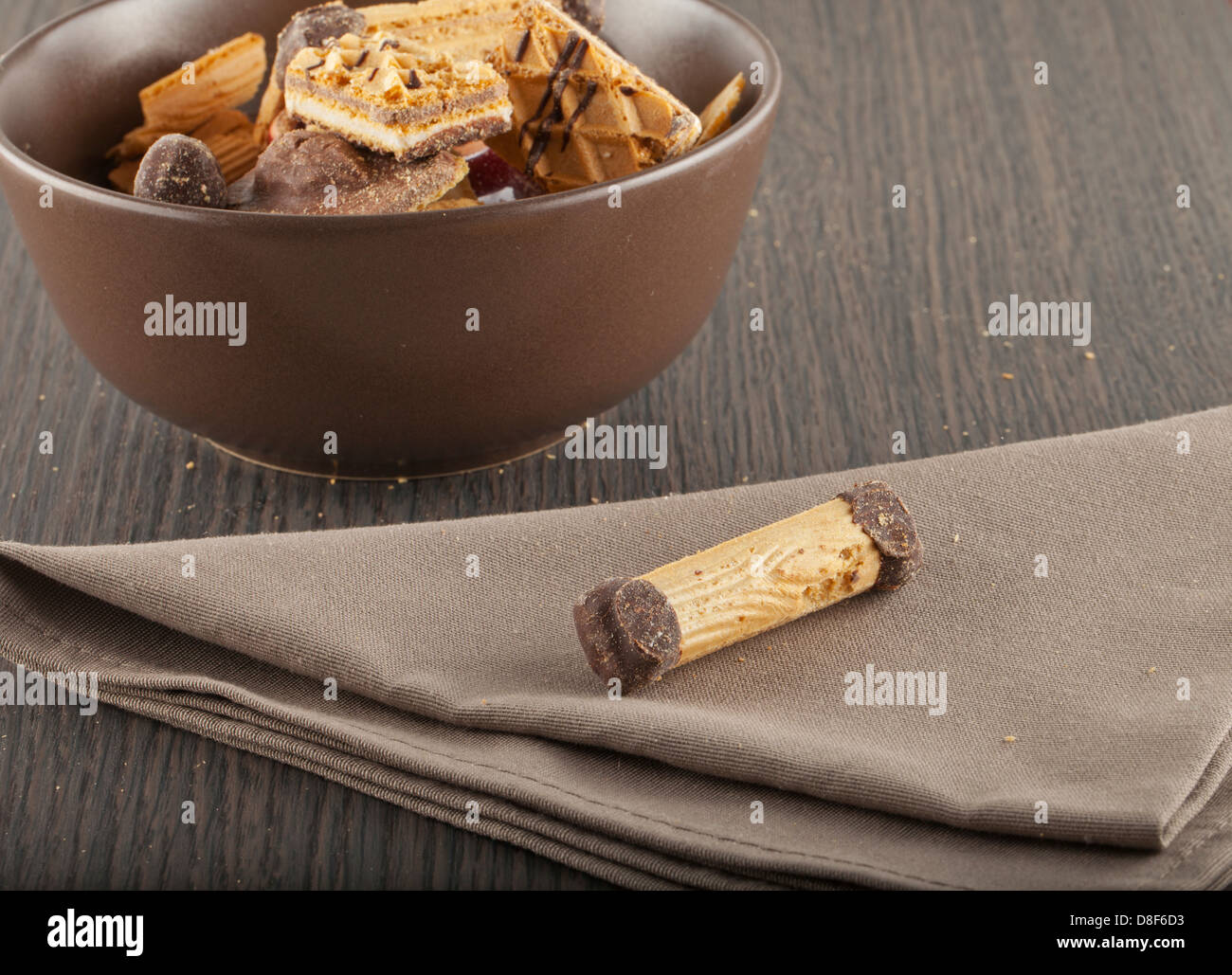 Chocolate biscuit over a towel, with other biscuits on the back Stock ...