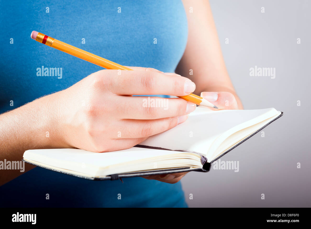 Child writing with pencil hi-res stock photography and images - Alamy