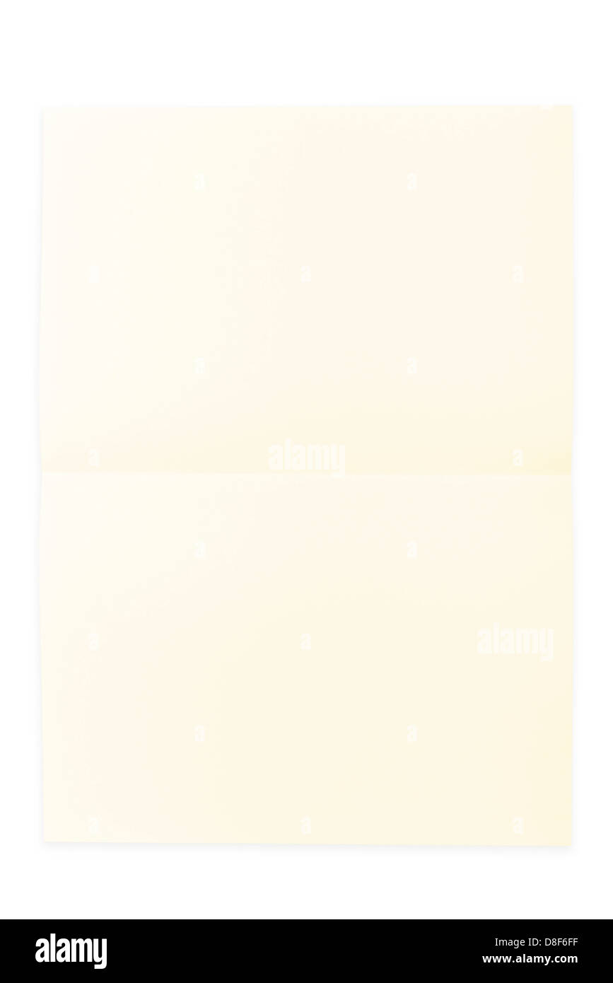Yellow paper sheet folded in half isolated over a white background ...