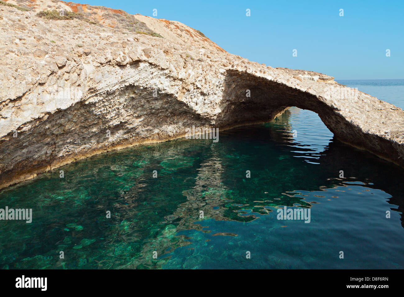 Caves and rock formations by the sea at Milos island in Greece Stock ...