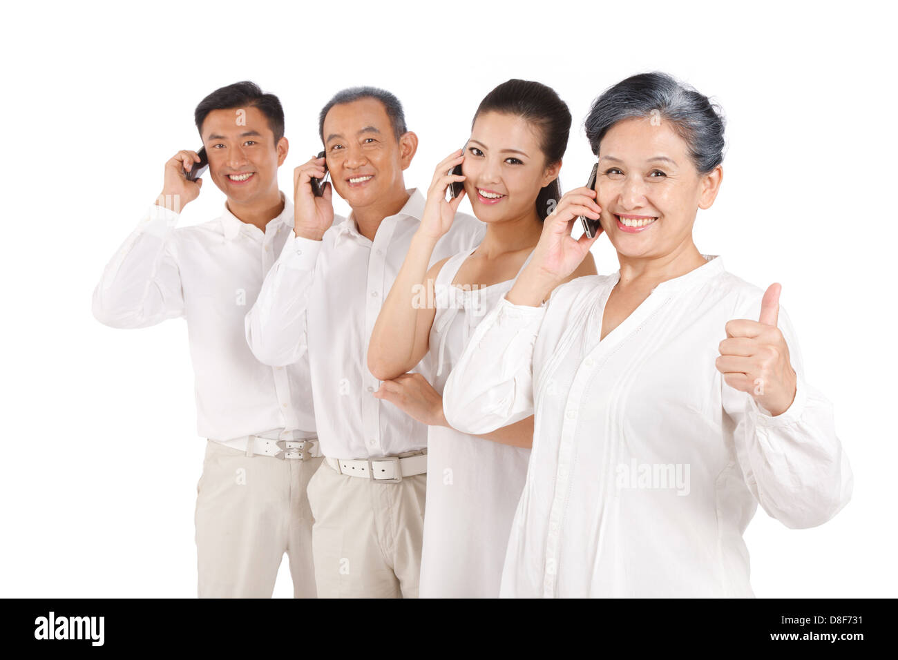 Old couple and young couple making phone call Stock Photo - Alamy