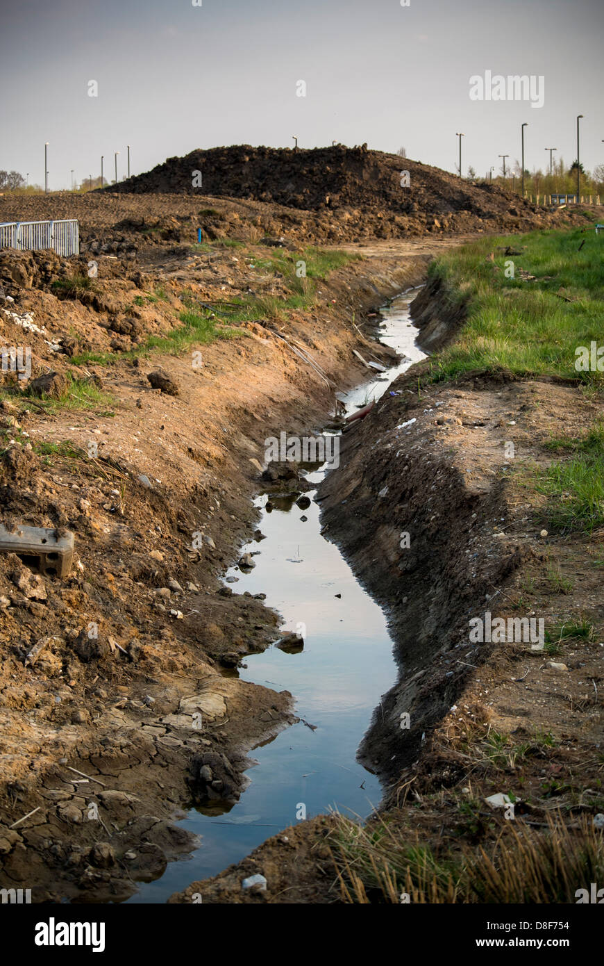 Drainage ditch along edge of construction site Stock Photo - Alamy