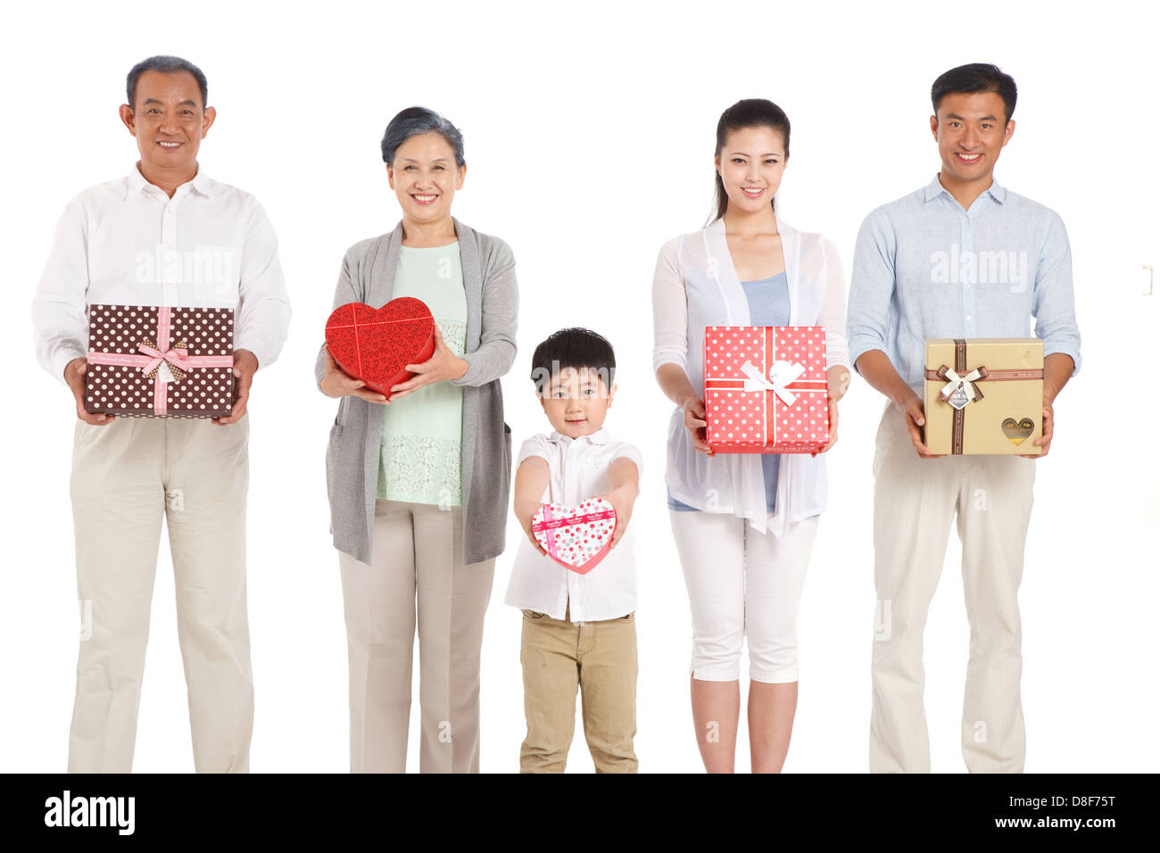 Whole family holding gift boxes Stock Photo - Alamy
