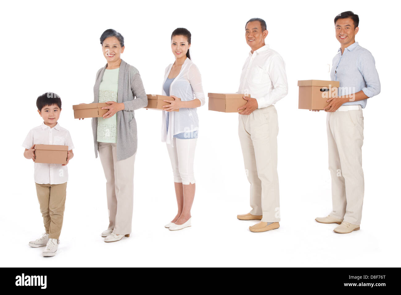 Whole family holding boxes Stock Photo - Alamy