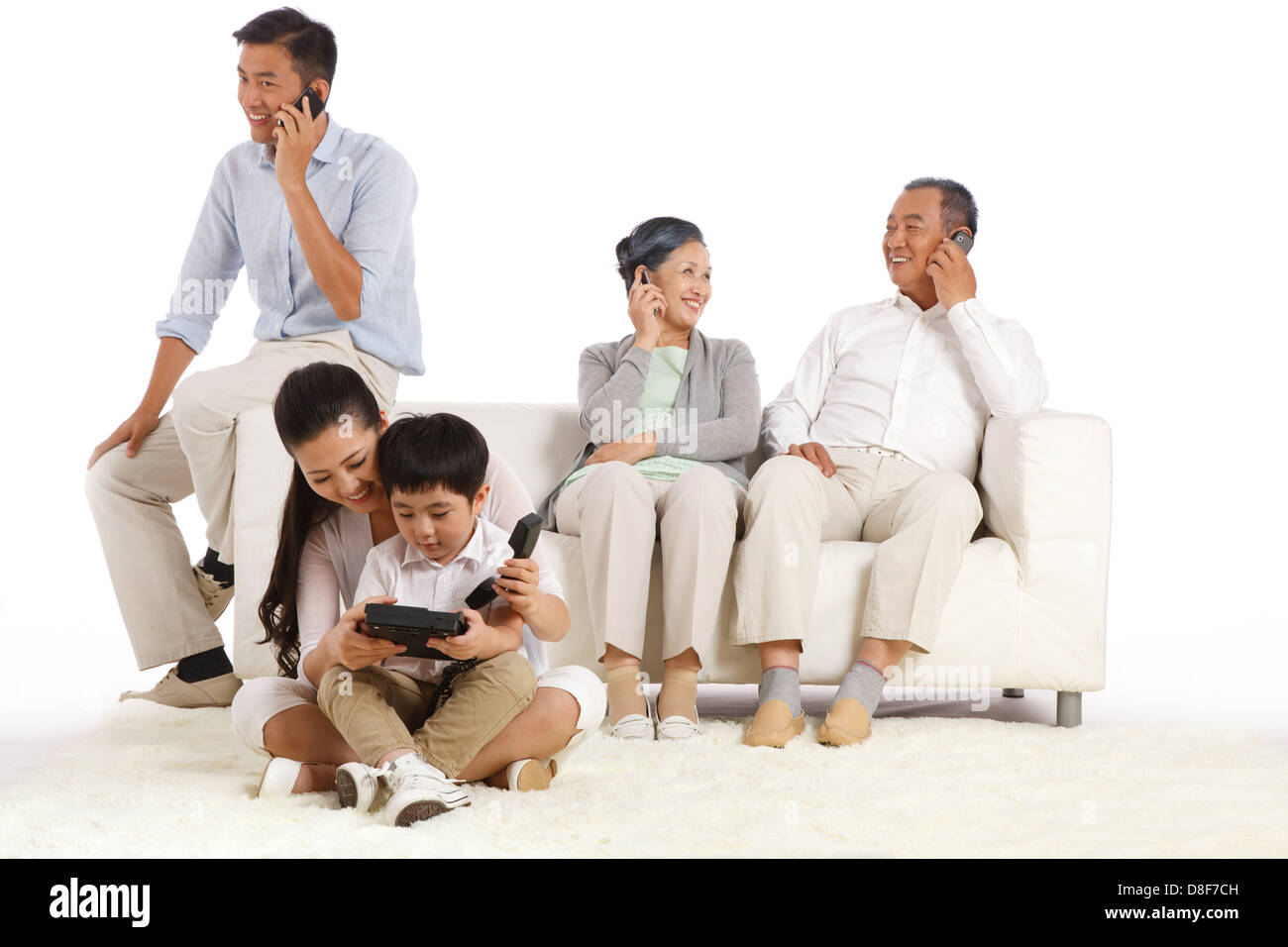 Whole family making phone call Stock Photo - Alamy